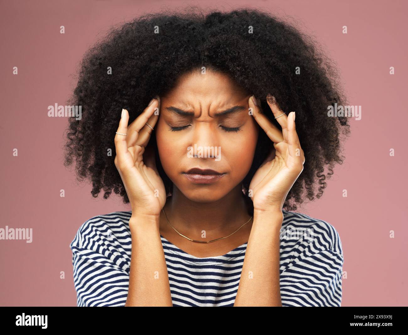 Black woman, studio and hands for tension headache, medical issue or ...