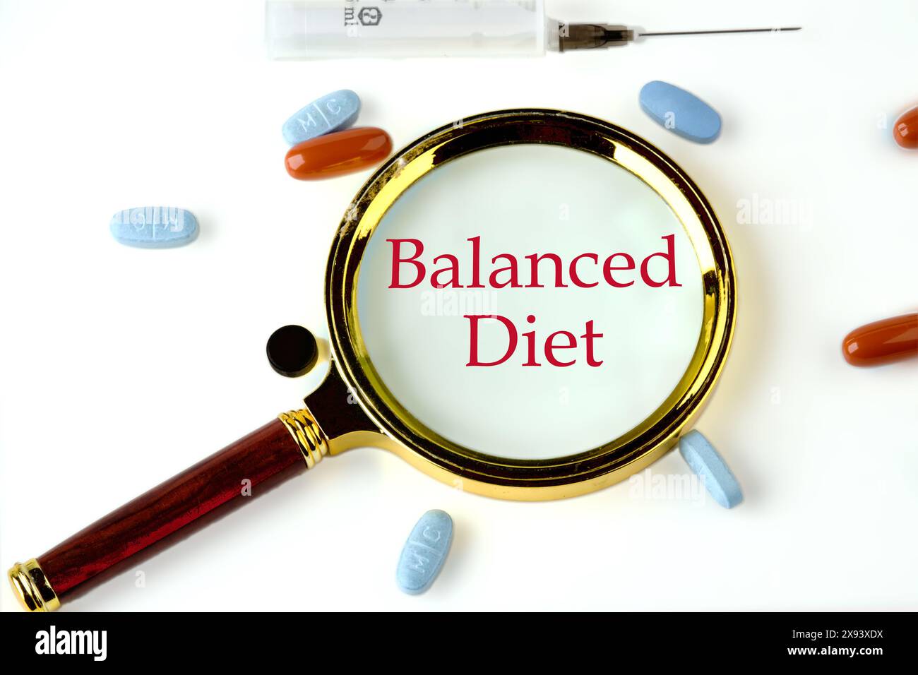Concept Balanced Diet. text written through a magnifying glass on a ...