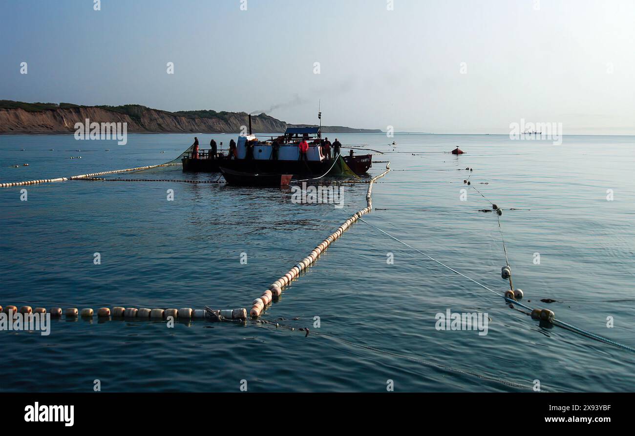 Industrial fishing boat. Net on sea surface. Saltwater fishing industry ...