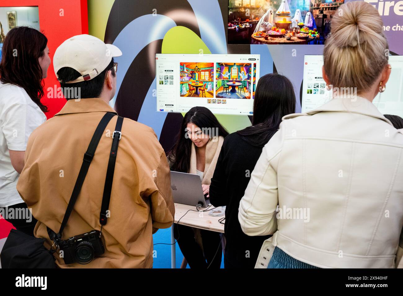 Visitors take the Adobe Firefly AI Image Creation Challenge at OFFF Barcelona at Disseny Hub ...