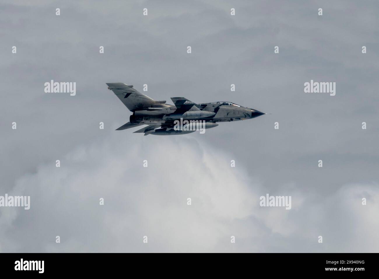 An Italian Air Force A-200 Tornado fighter aircraft flies over ...
