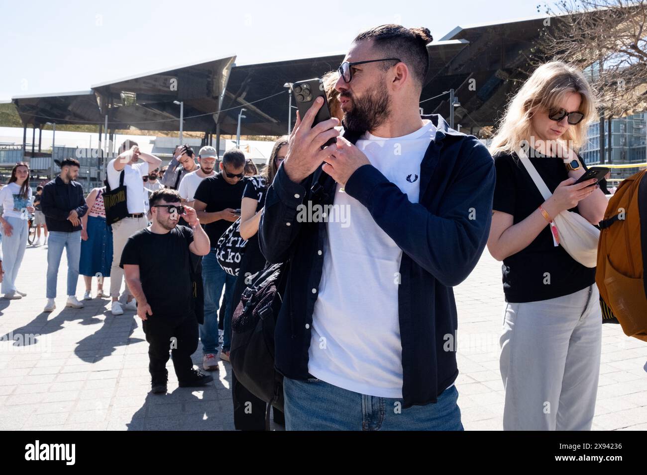 Attendees queue for a popular talk at the Open Room at OFFF Barcelona ...