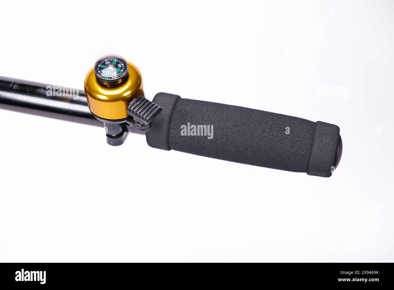 Gold bell with compass for bicycle Stock Photo - Alamy