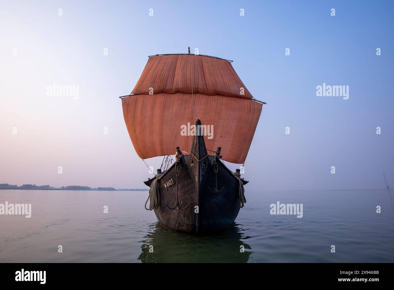 A traditional sailing wooden boat on the Jamuna River, Manikganj ...
