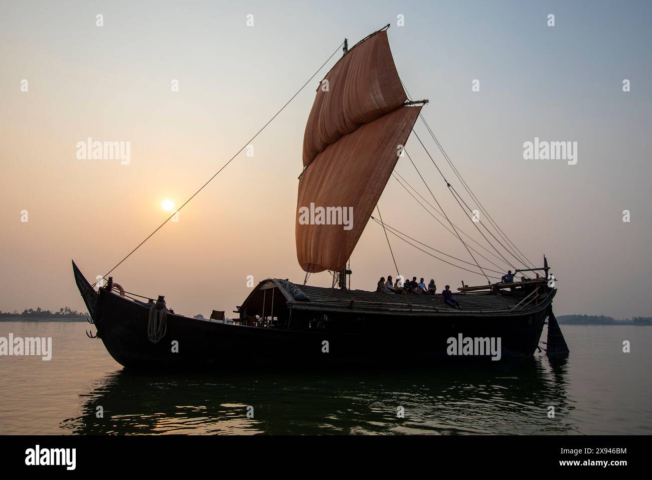 A traditional sailing wooden boat on the Jamuna River, Manikganj ...