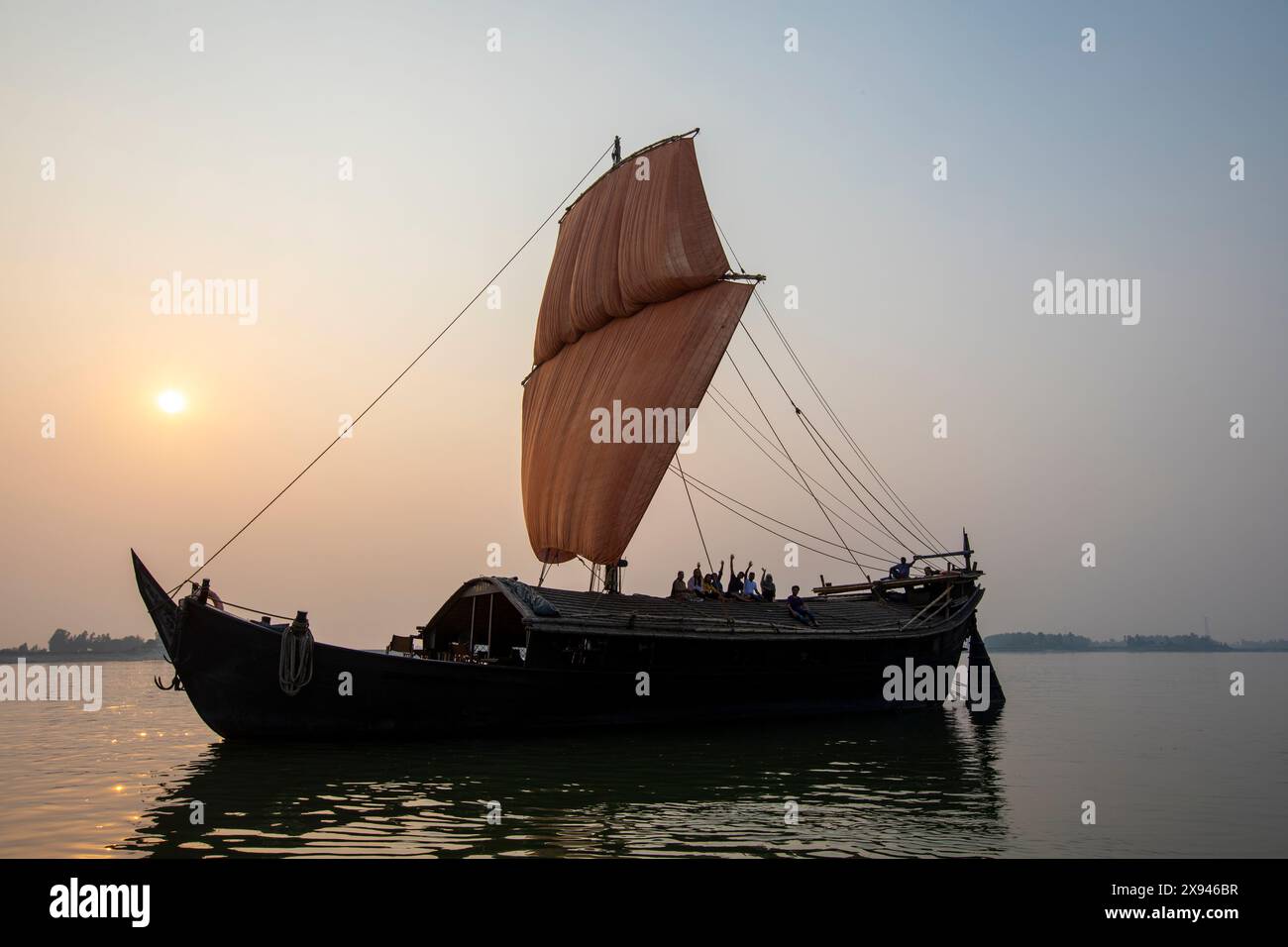 A traditional sailing wooden boat on the Jamuna River, Manikganj ...