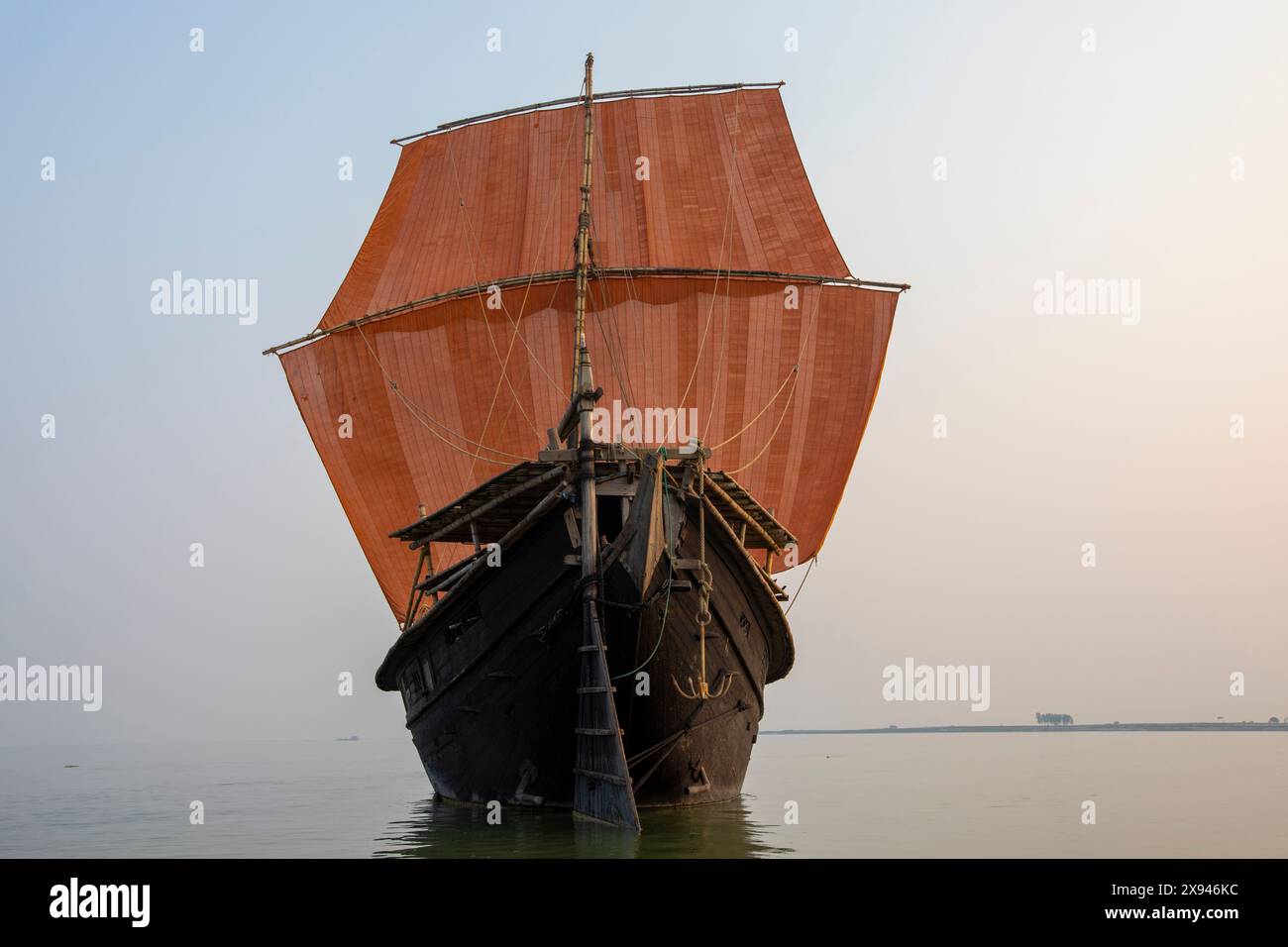 A traditional sailing wooden boat on the Jamuna River, Manikganj ...