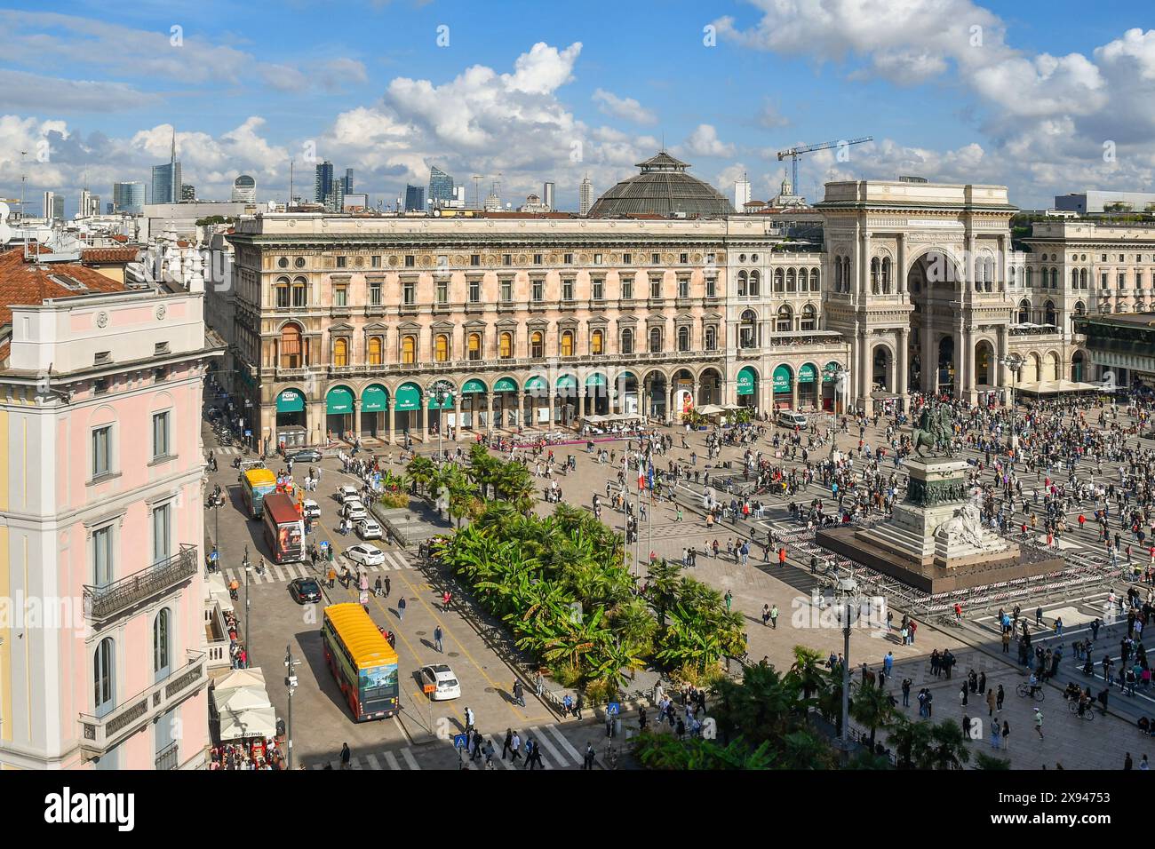 Elevated view of Piazza del Duomo (Cathedral Square) crowded with people in autumn, Milan ...