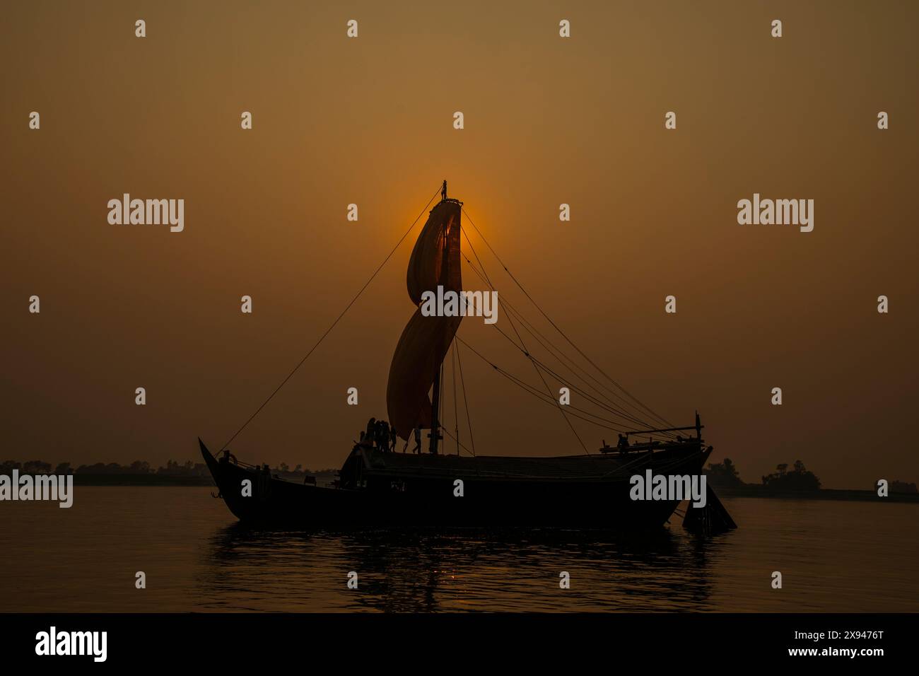 A traditional sailing wooden boat on the Jamuna River, Manikganj ...