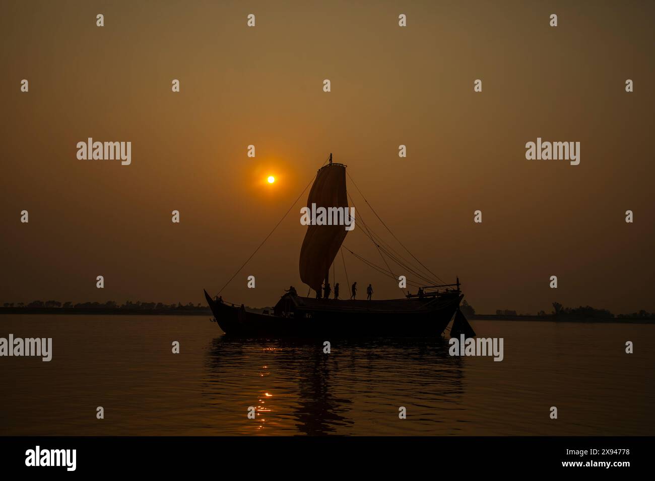 A traditional sailing wooden boat on the Jamuna River, Manikganj ...