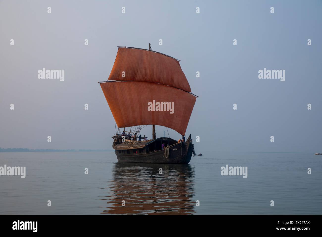 A traditional sailing wooden boat on the Jamuna River, Manikganj ...