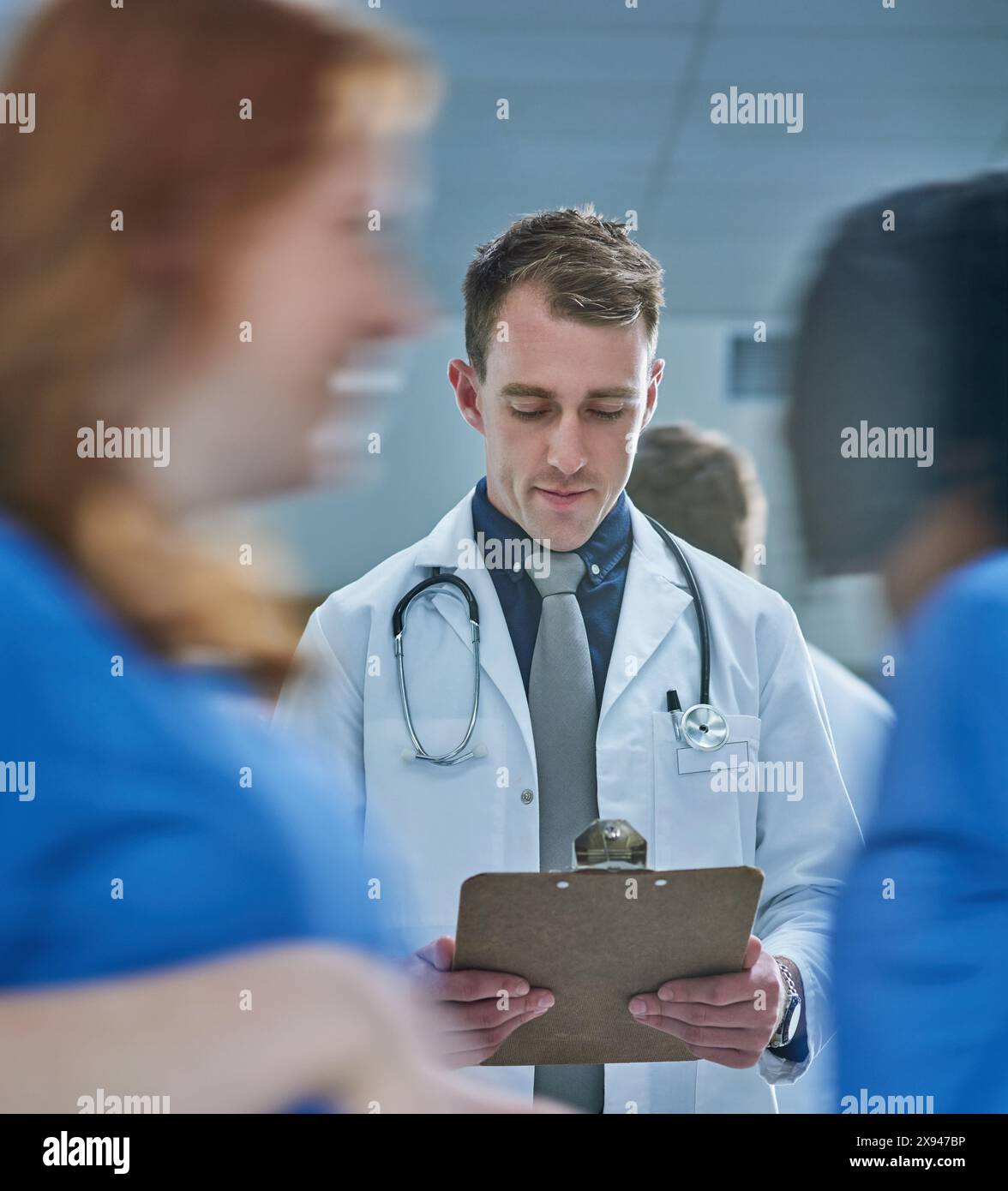 Healthcare, doctor and clipboard with hospital, busy and reading charts ...
