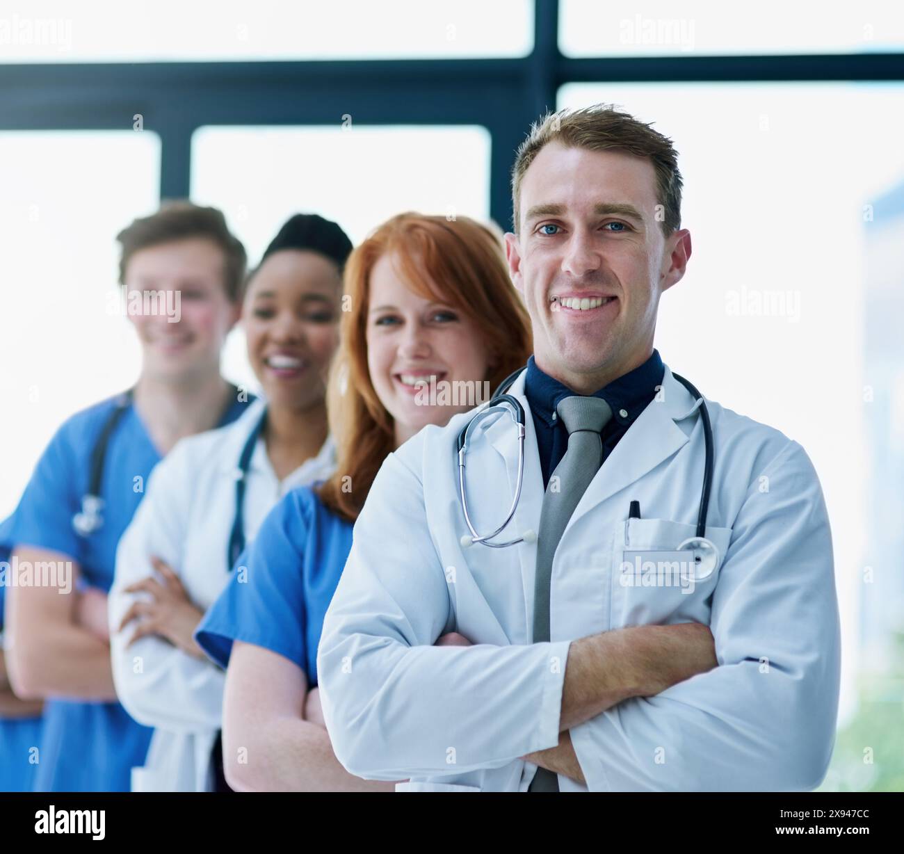 Portrait, doctors and arms crossed with smile for management, healthcare and hospital teamwork ...