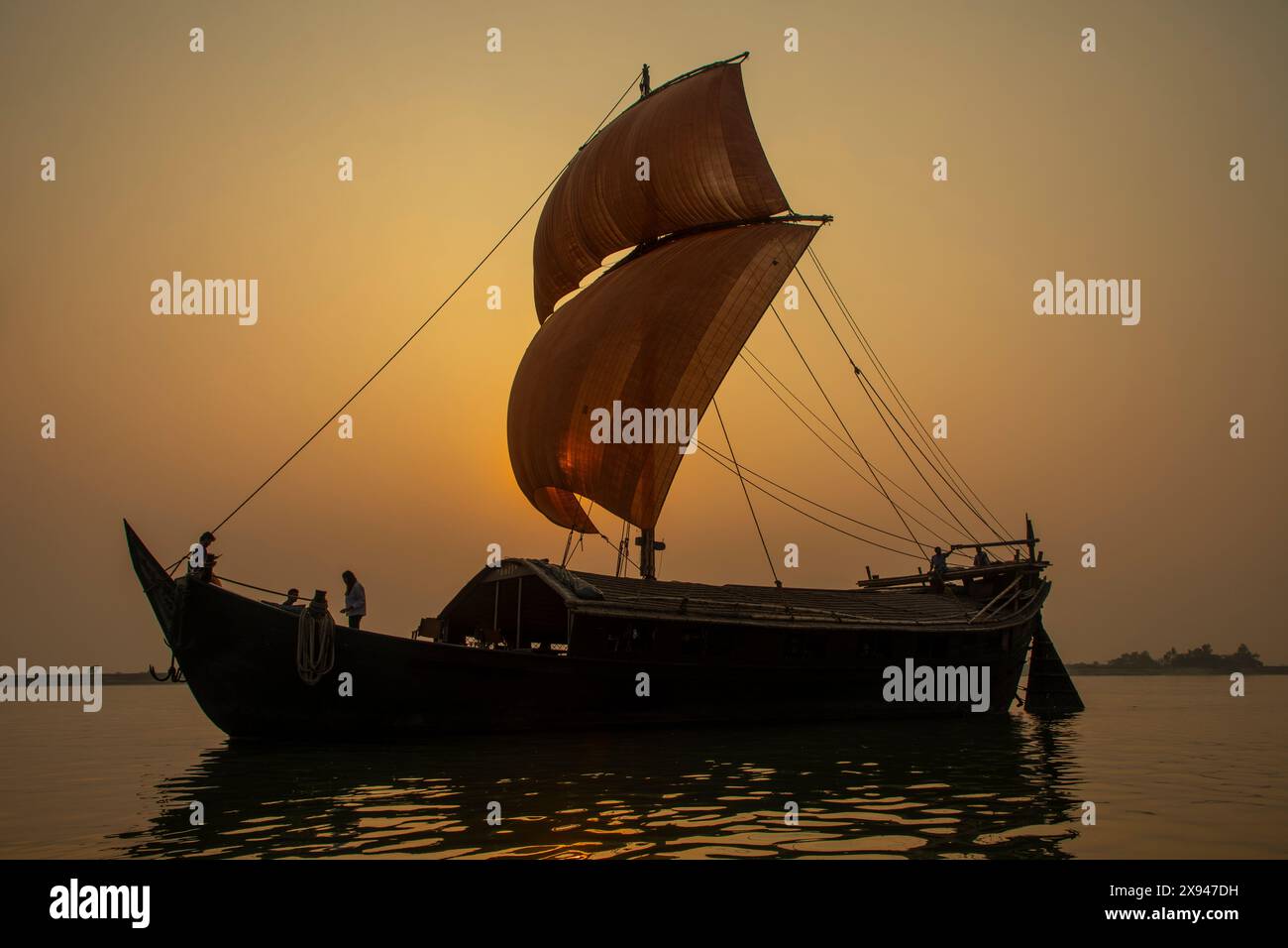 A traditional sailing wooden boat on the Jamuna River, Manikganj ...