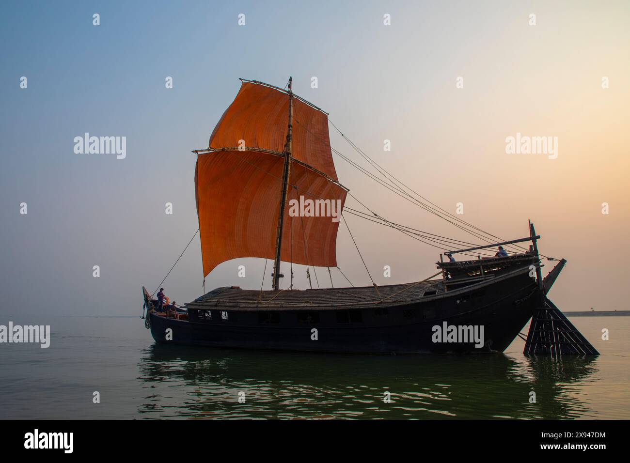 A traditional sailing wooden boat on the Jamuna River, Manikganj ...
