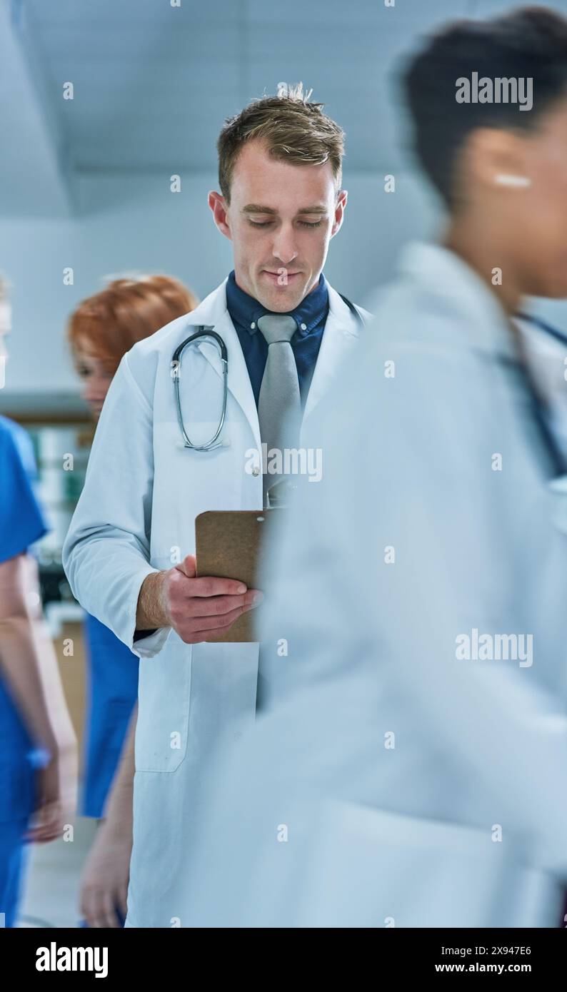 Healthcare, doctor and clipboard with clinic, busy and reading charts ...