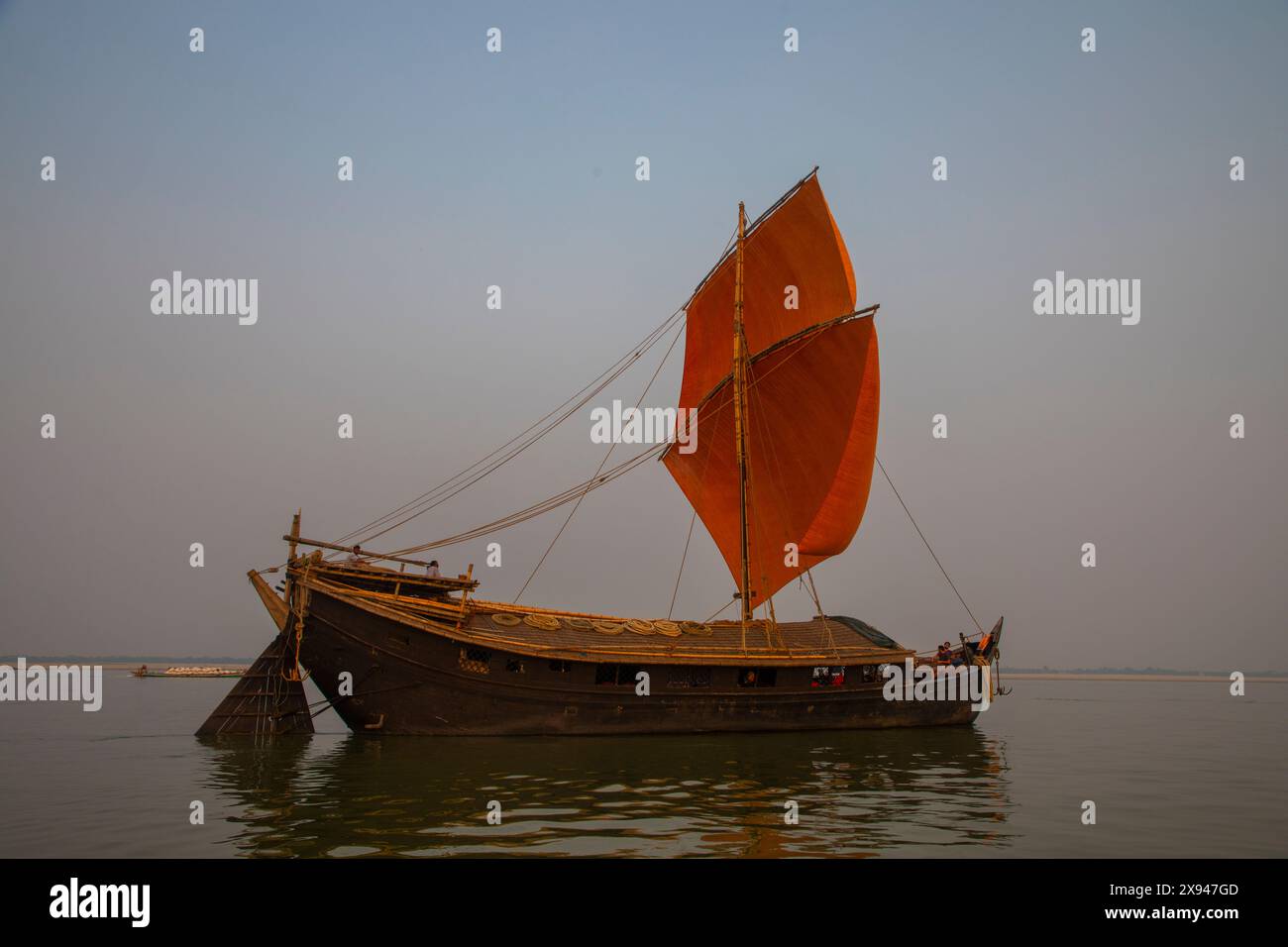 A traditional sailing wooden boat on the Jamuna River, Manikganj ...