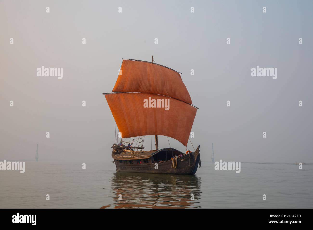 A traditional sailing wooden boat on the Jamuna River, Manikganj ...