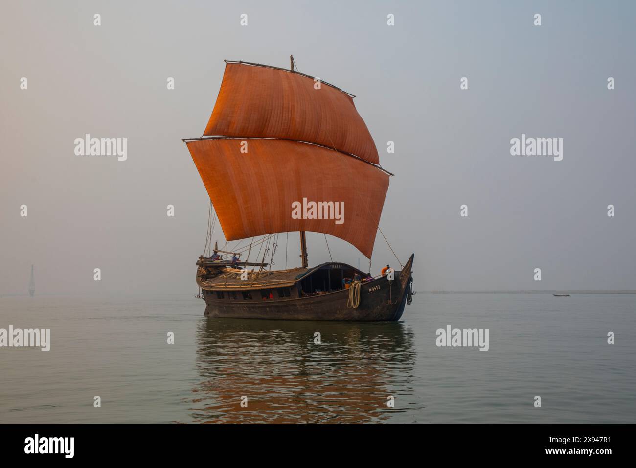 A traditional sailing wooden boat on the Jamuna River, Manikganj ...