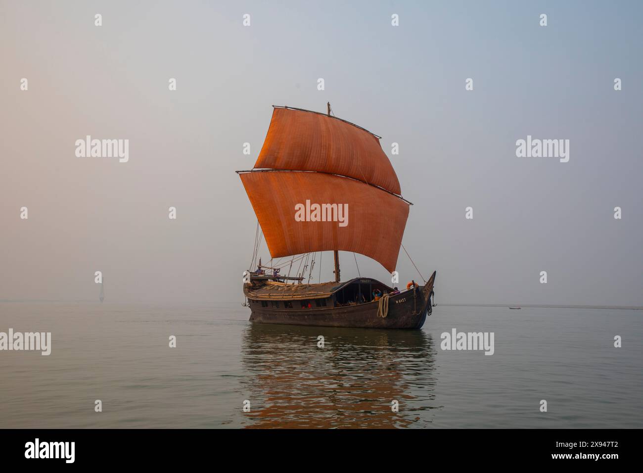 A traditional sailing wooden boat on the Jamuna River, Manikganj ...