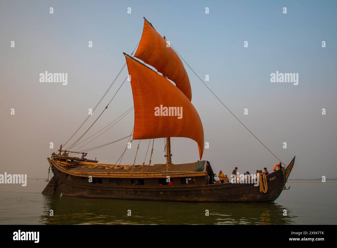 A traditional sailing wooden boat on the Jamuna River, Manikganj ...
