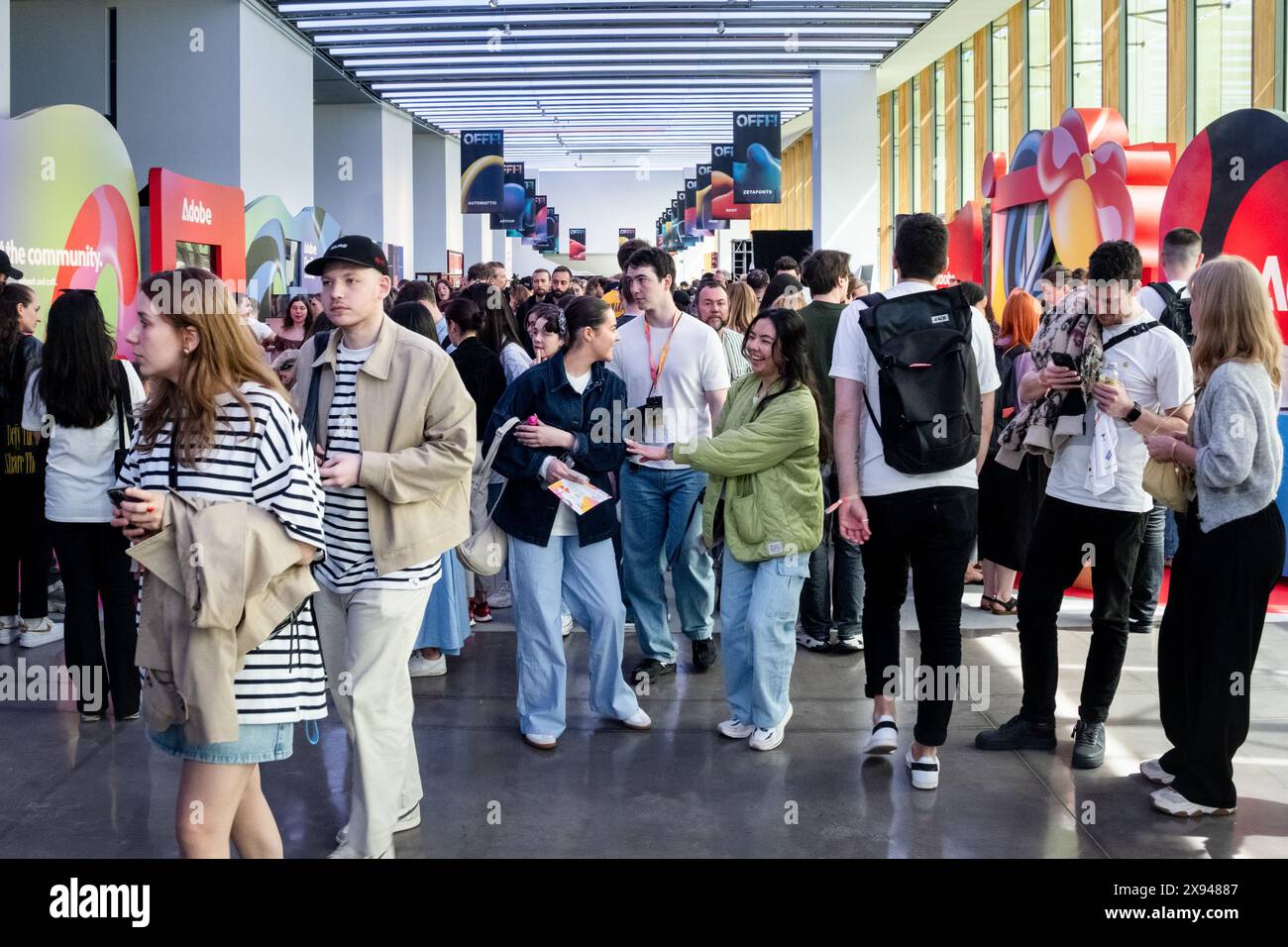 Attendees mingle, walk and check out the offers in the retail market ...