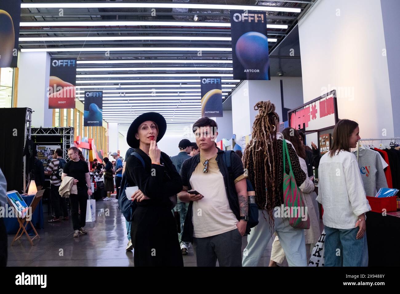 Attendees mingle, walk and check out the offers in the retail market ...