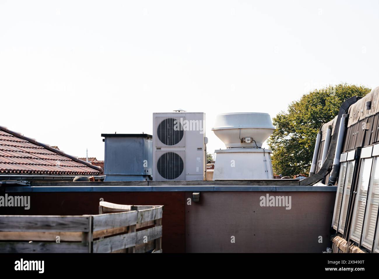Rooftop view of HVAC units and ventilation systems on a building in ...