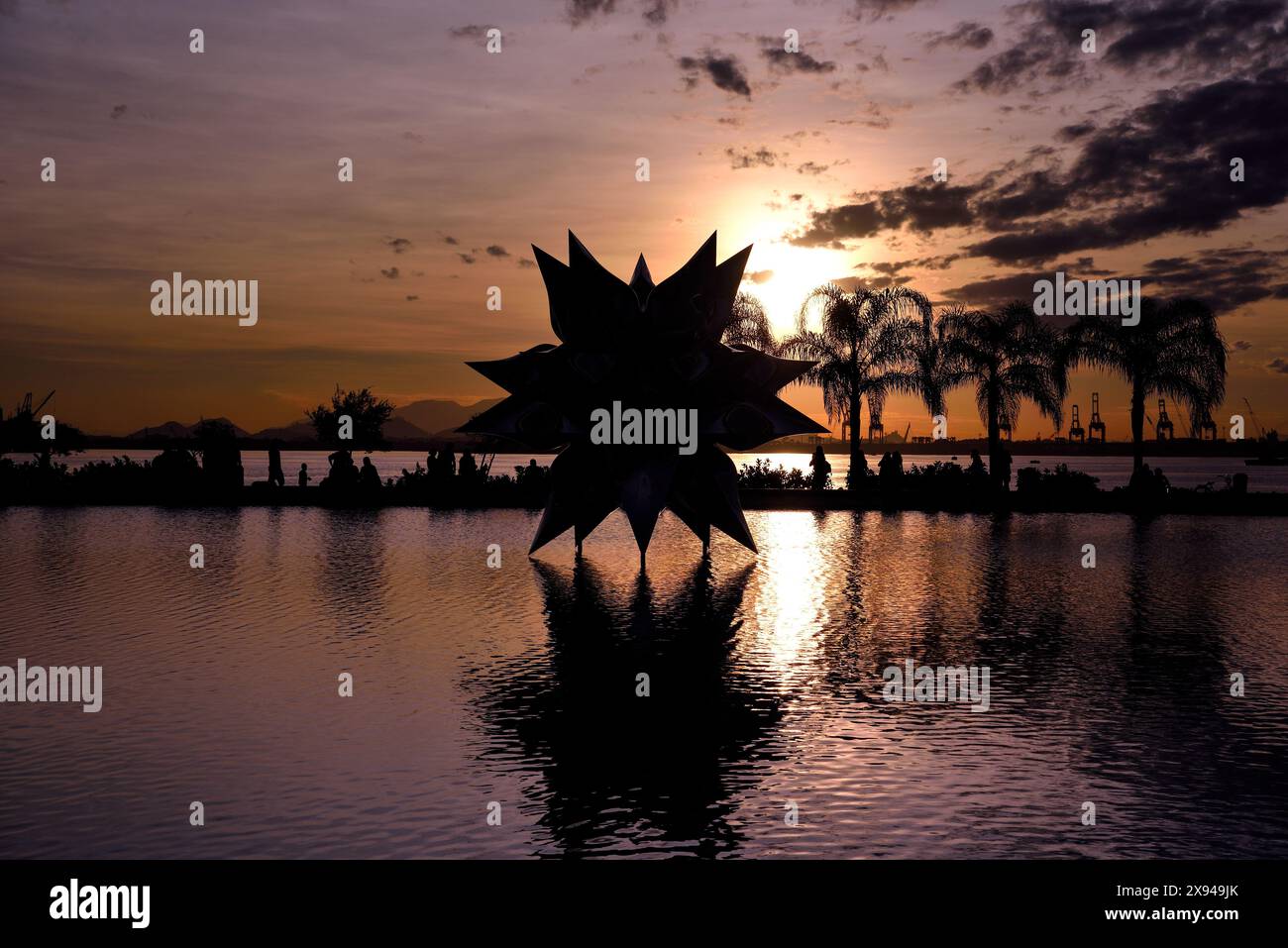 The Silhouette of the Puffed Star II Sculpture on the Water Surface of ...