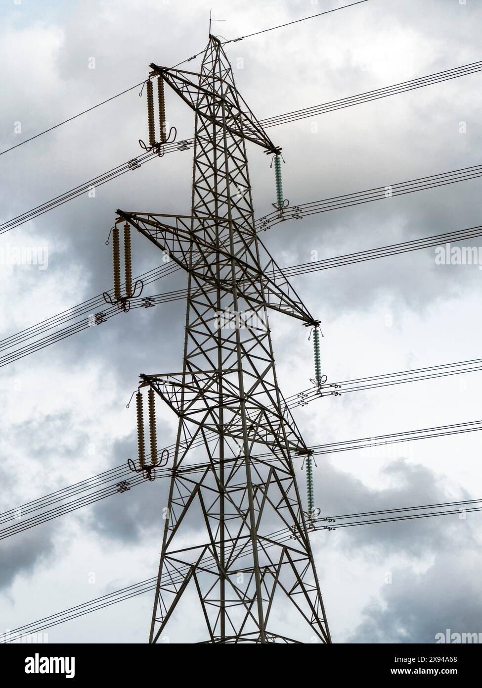 Electric overhead power carrying pylon Stock Photo - Alamy