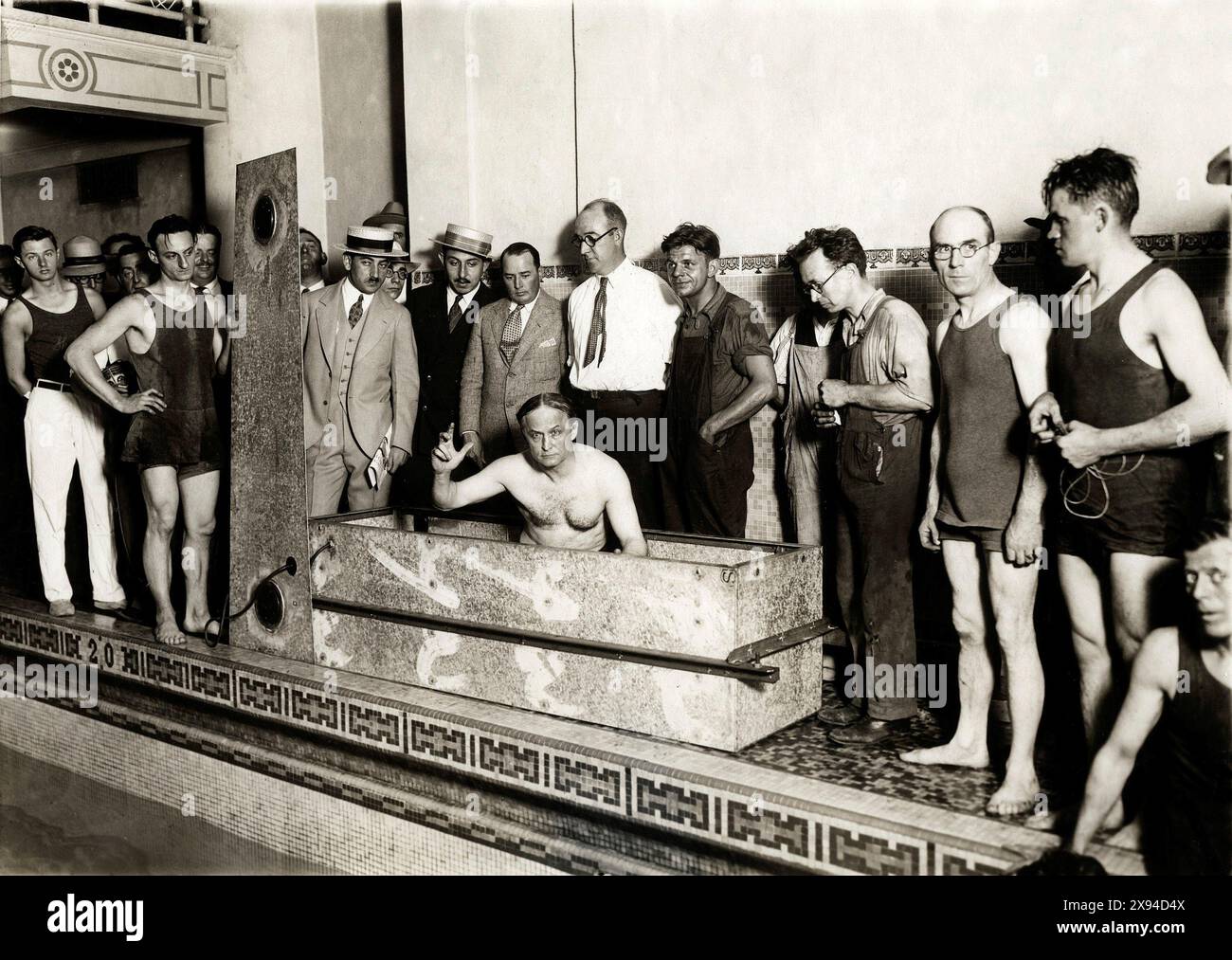 Harry Houdini in a steel box in which he has just spent an hour and a ...