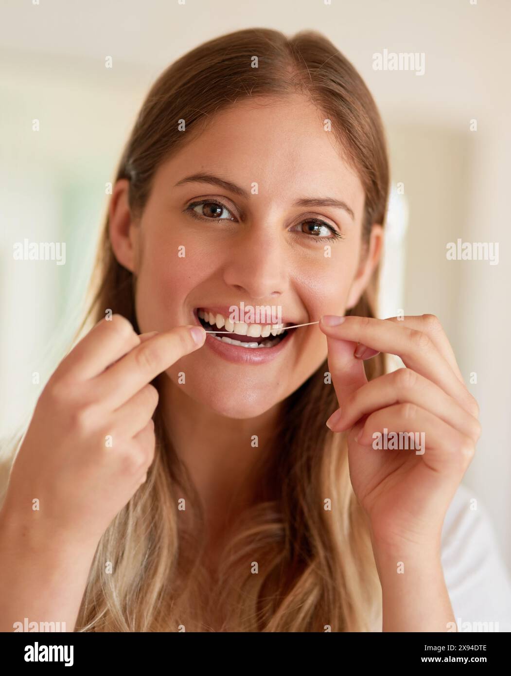 Portrait, girl and floss teeth in bathroom for dental care or bad ...