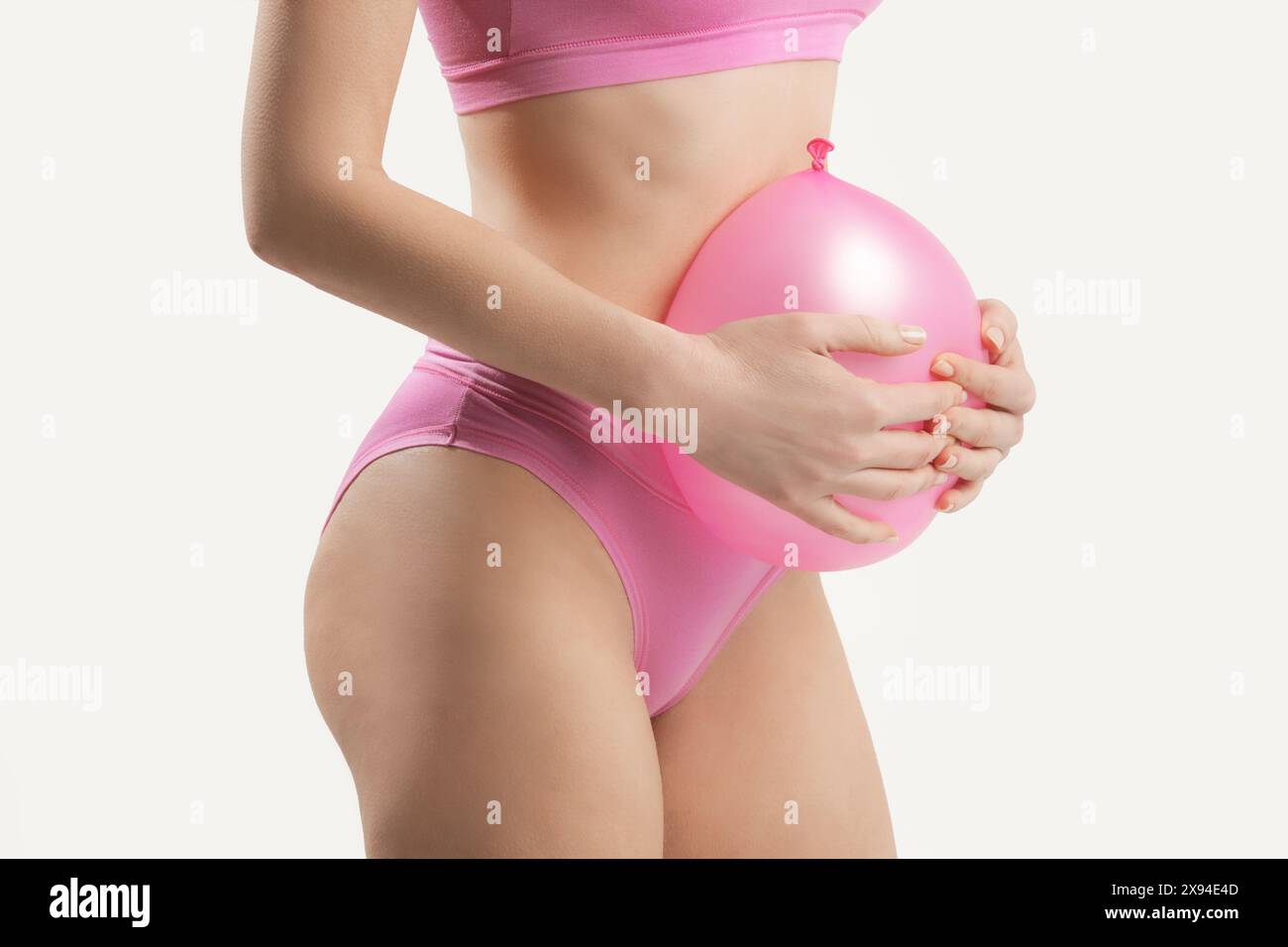 Young Woman Holding Balloon As A Sign Of An Stomach Inflation Bloating And Menstrual Cramps