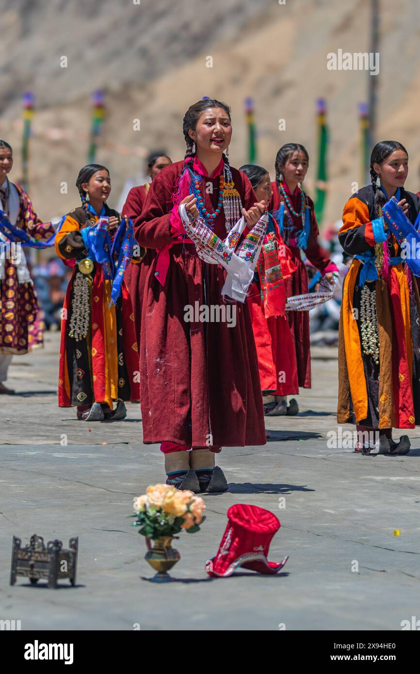 A group of young Buddhist girls performing traditional dance sequence ...