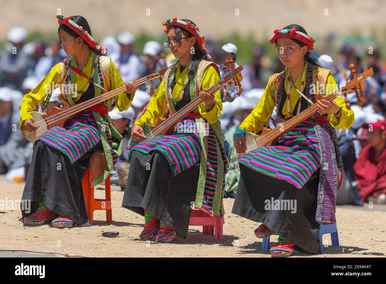Portrait of young Ladakhi girls wearing traditional attire and playing ...