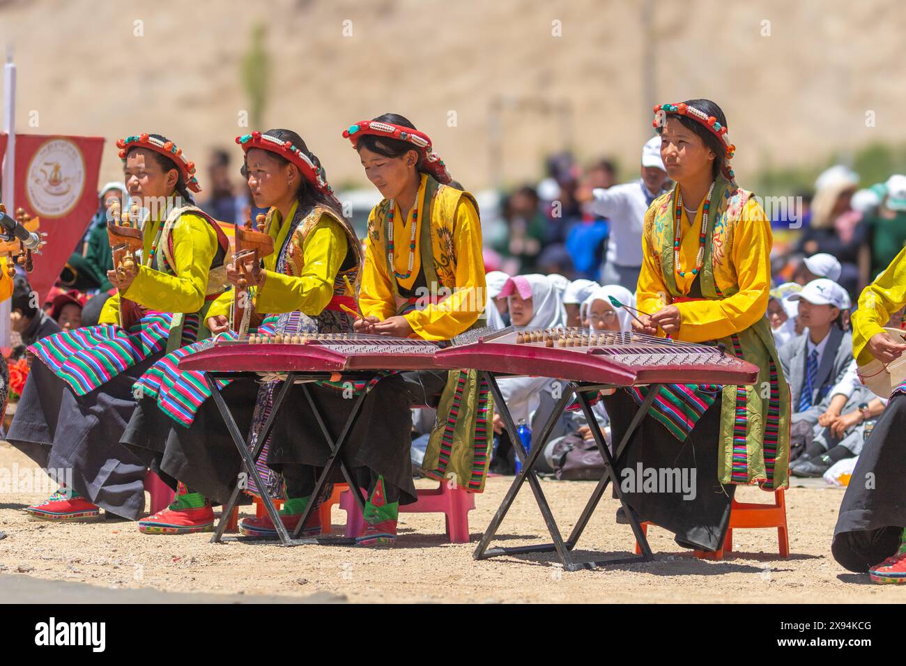 Portrait of young Ladakhi girls wearing traditional attire and playing ...