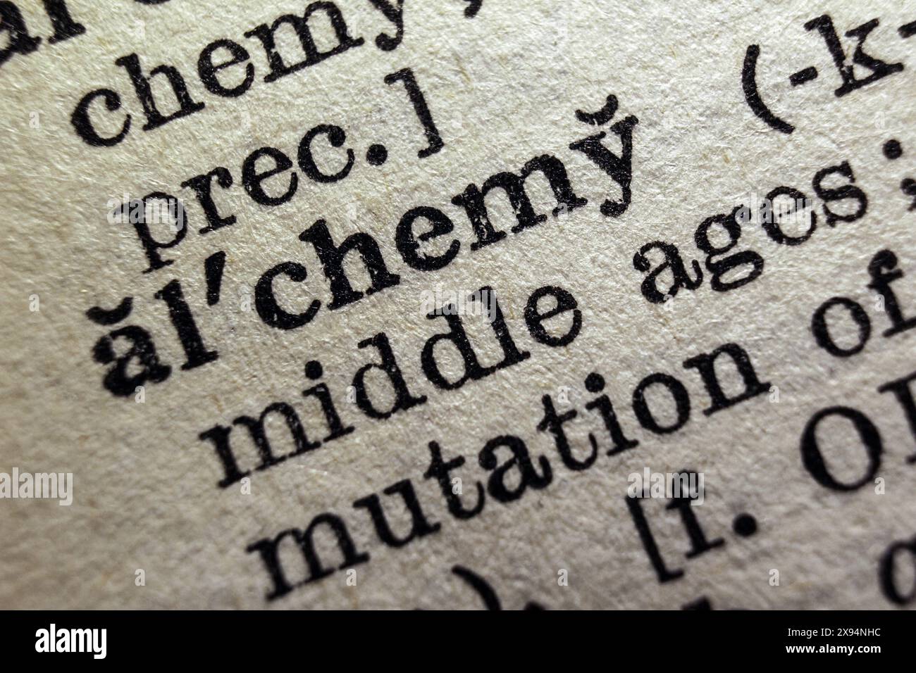Word alchemy on dictionary page, macro close-up Stock Photo - Alamy