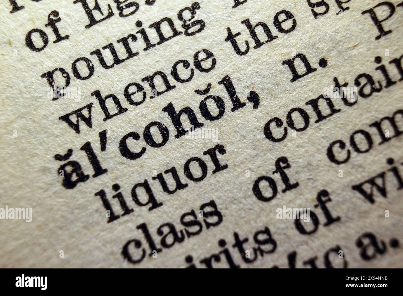 Word alcohol on dictionary page, macro close-up Stock Photo - Alamy