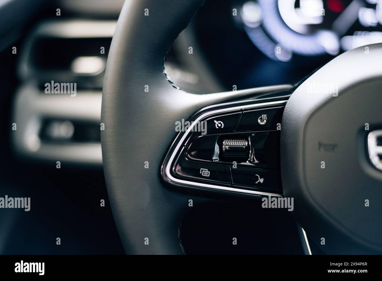 control buttons on the steering wheel of a car Stock Photo - Alamy