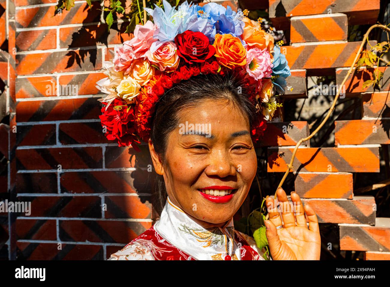 Woman in flower wall hi-res stock photography and images - Alamy