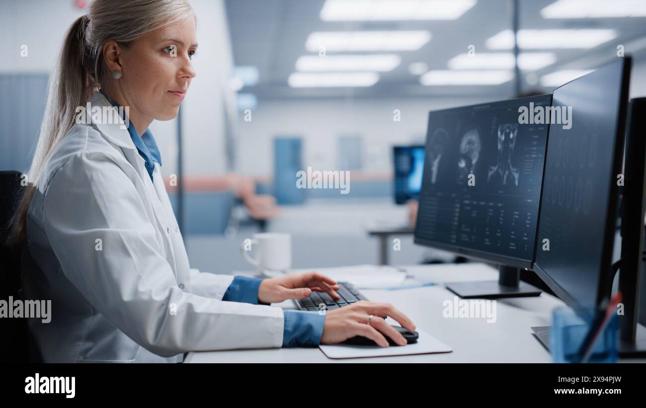 Medical Hospital Research Lab: Female Neurosurgeon Using Computer with ...