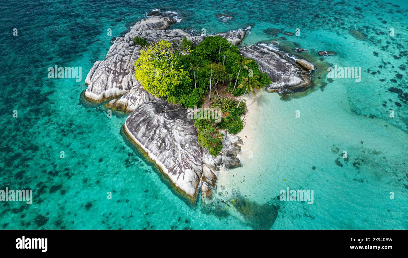 Aerial of a little islet off the coast of Belitung island off the coast ...