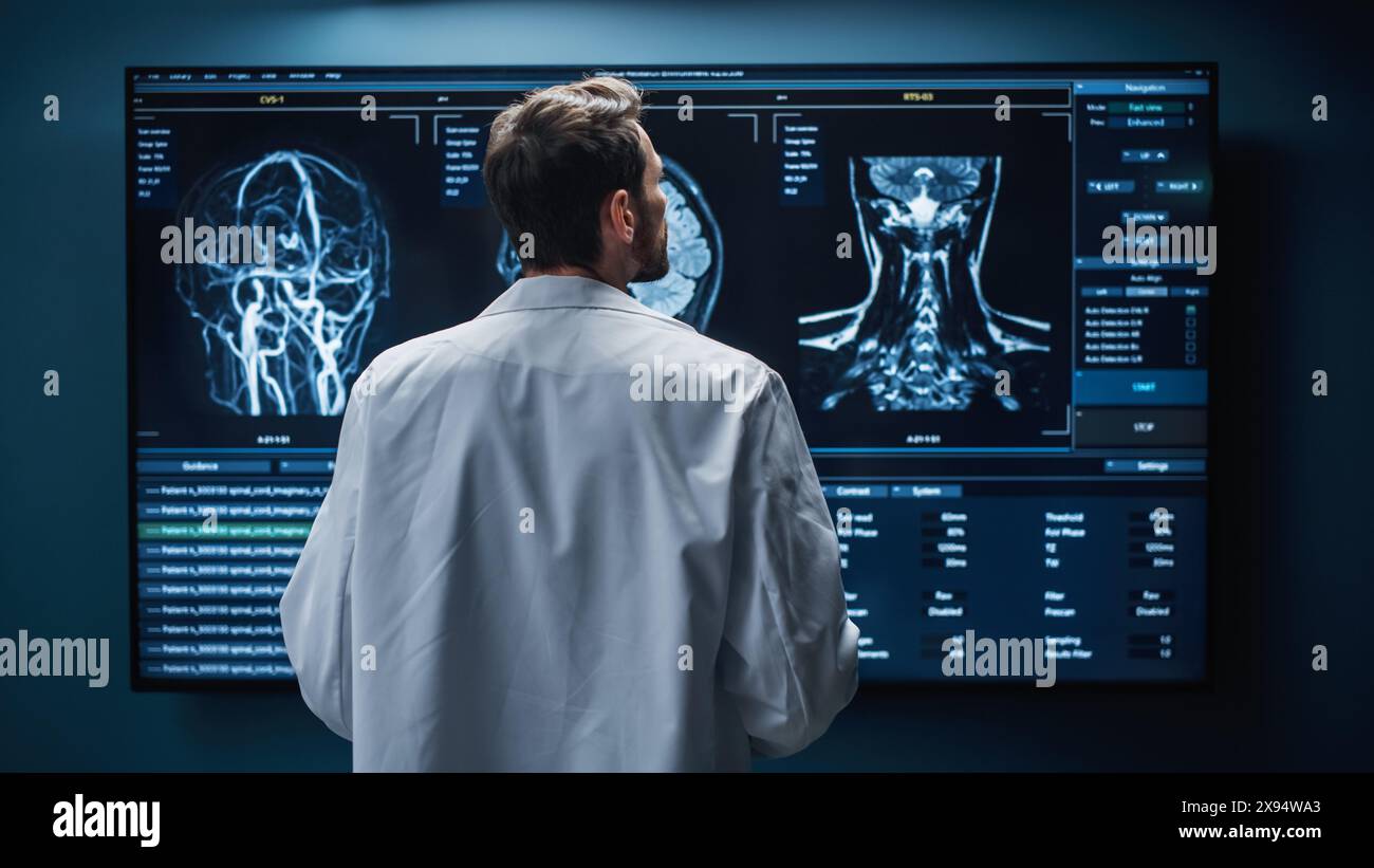 Medical Hospital Research Lab: White Male Neuroscientist Looking at TV ...