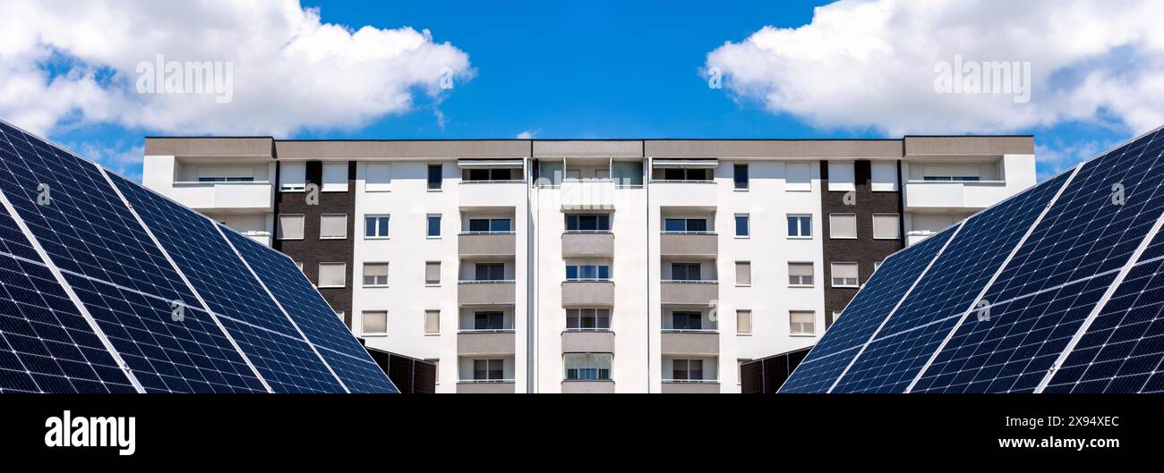 Solar panels in front of residential buildings in city. Renewable solar ...