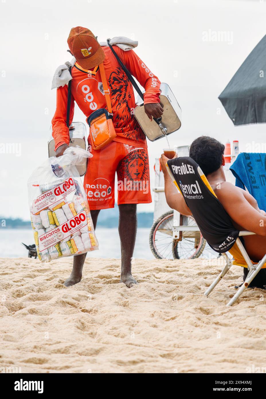 Young man selling a special tea called mate at Leblon Beach in Rio de ...