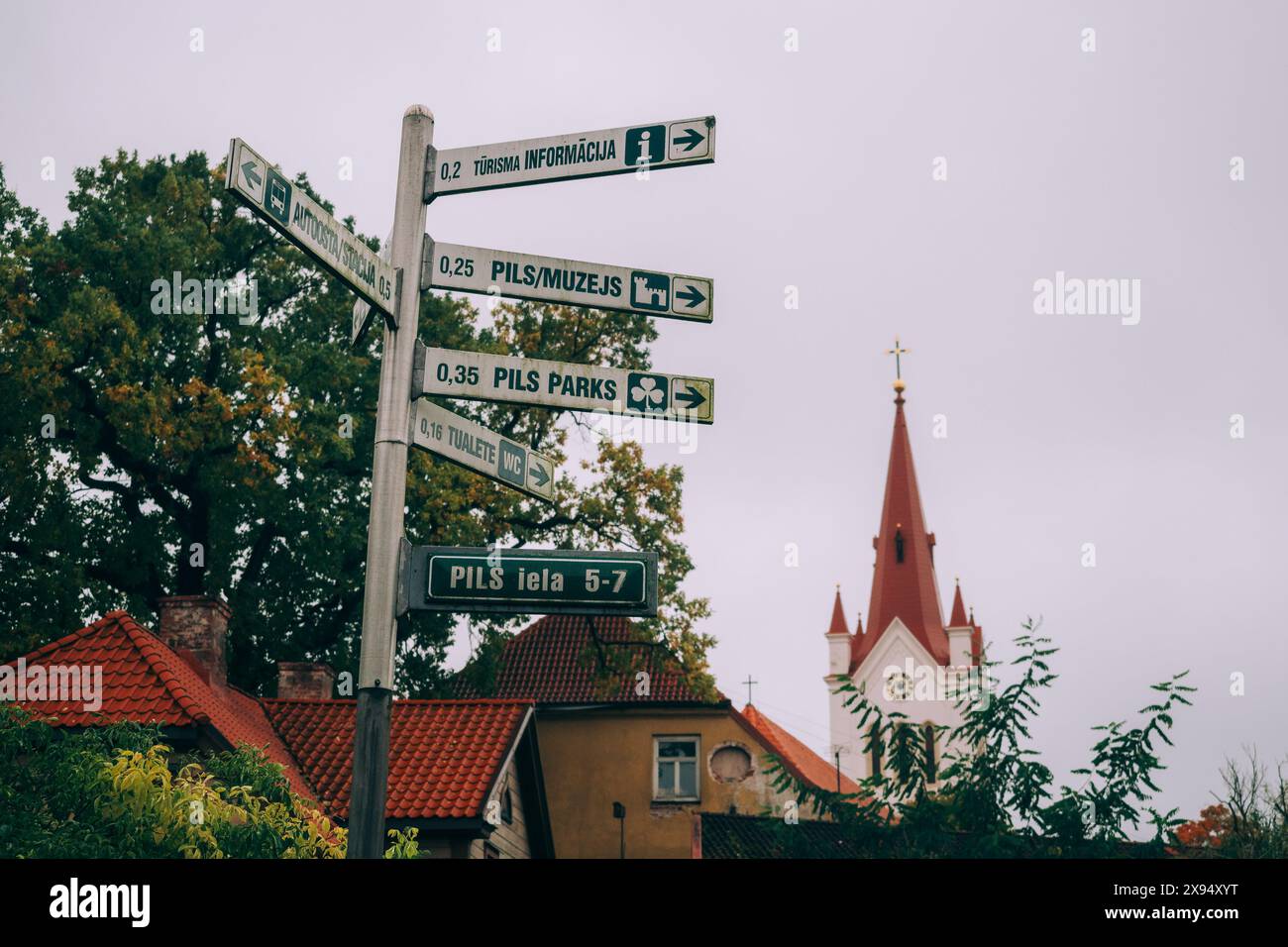 Signpost and St. John's Church in the Medieval Cesis Old Town, Cesis ...