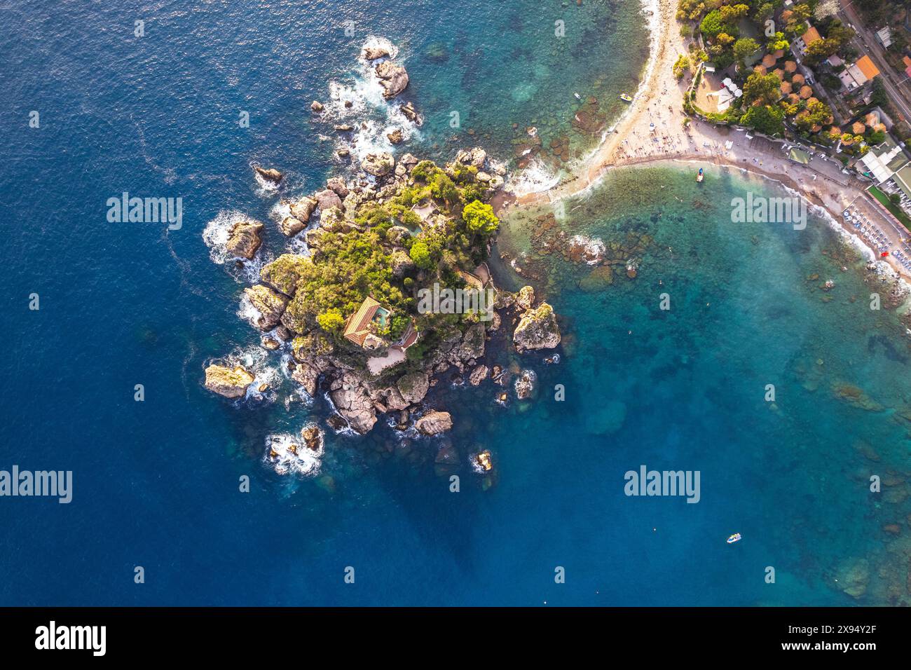 Top down view of the rocky island and the beach of Isola Bella ...