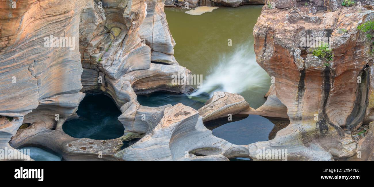 View of complex of smooth, cylindrical potholes and natural rock ...