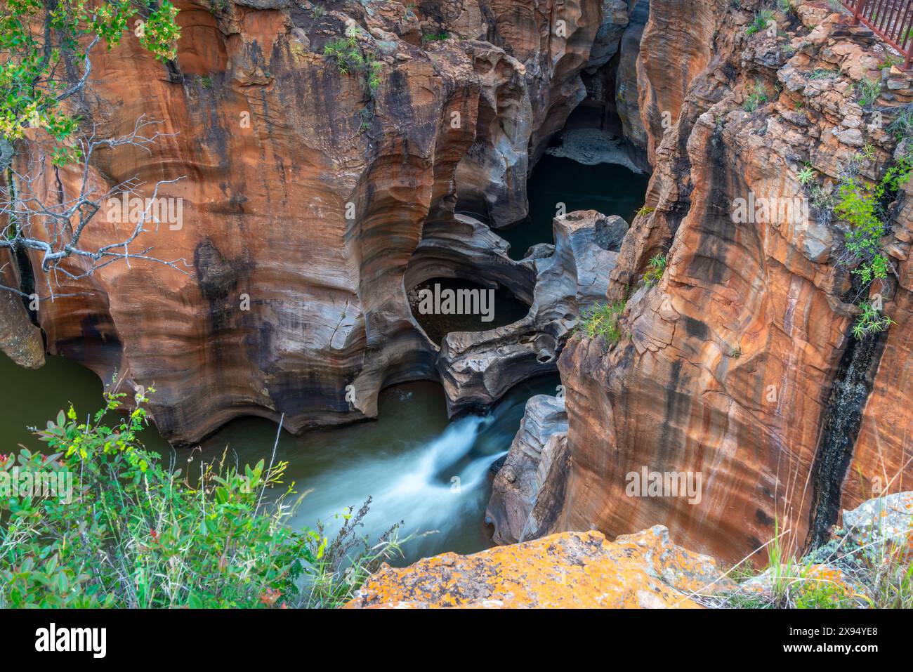 View of complex of smooth, cylindrical potholes and natural rock ...