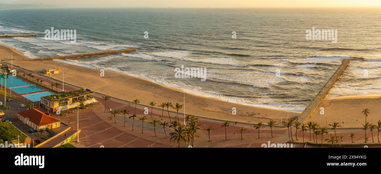 Elevated view of beaches, promenade and Indian Ocean at sunrise, Durban ...